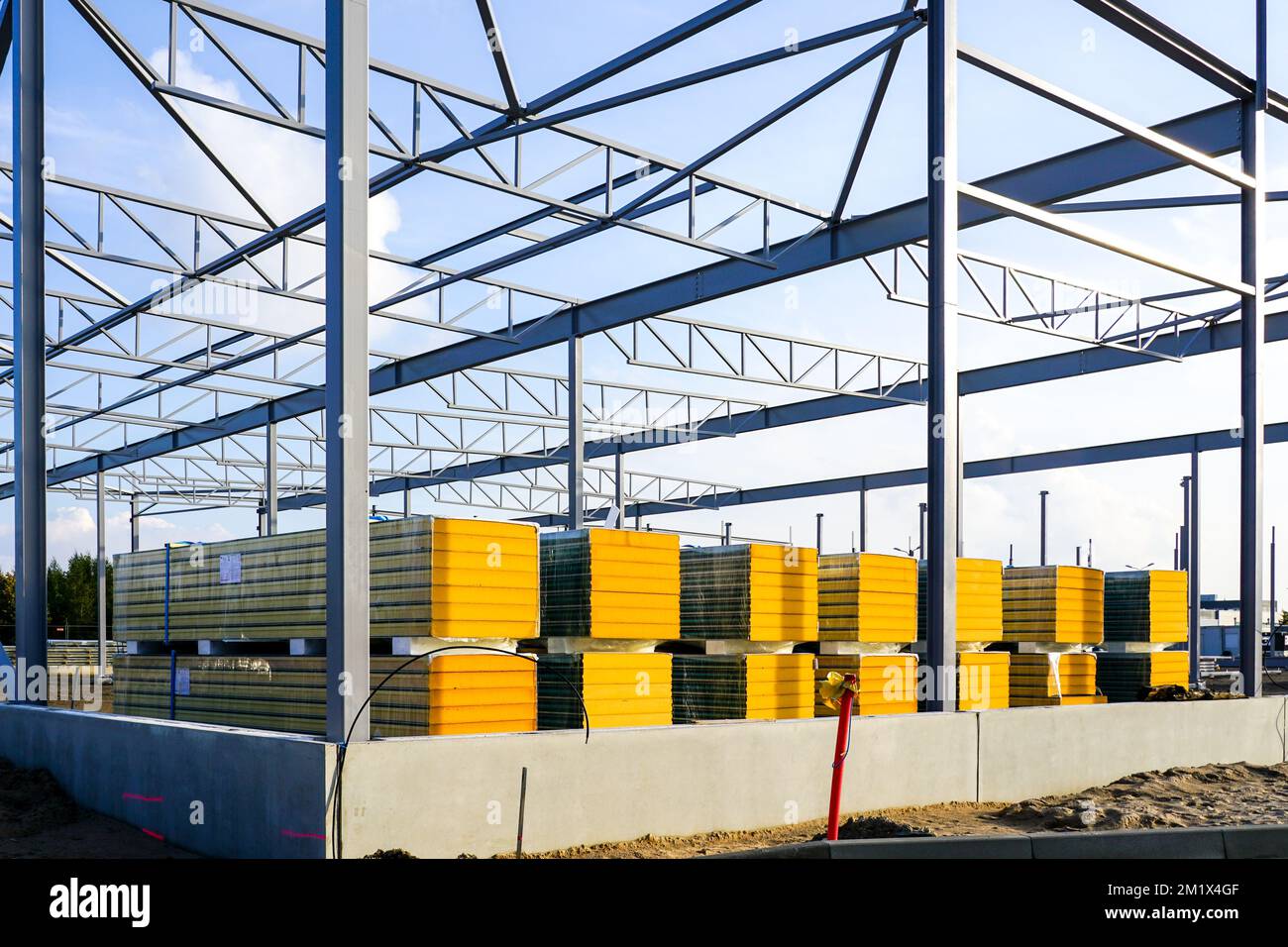 Assembled steel frame and stacks of sandwich panels for the facade of a ...