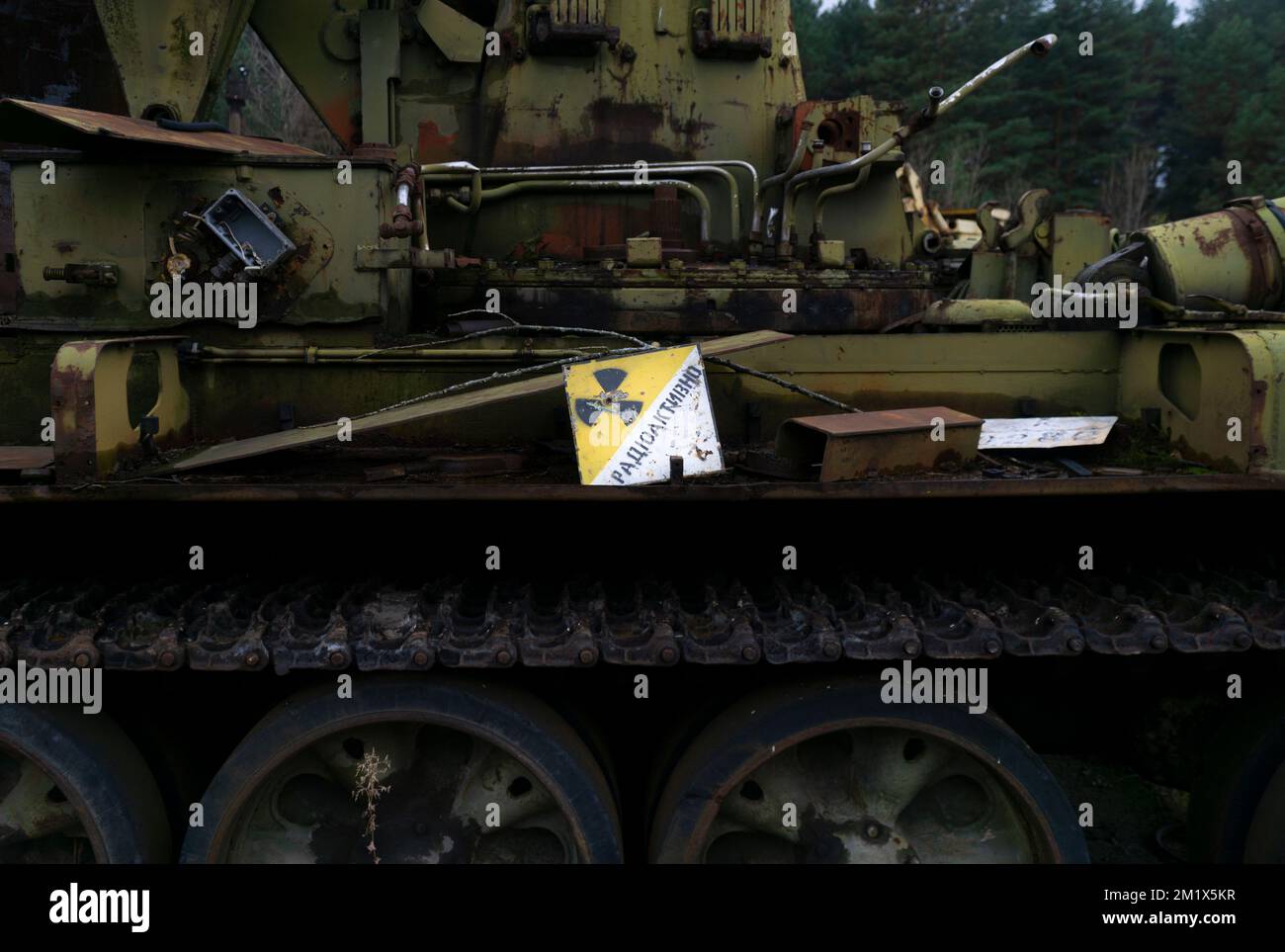 Close up a radioactive logo symbol sign in ukranian over a rusty green ...