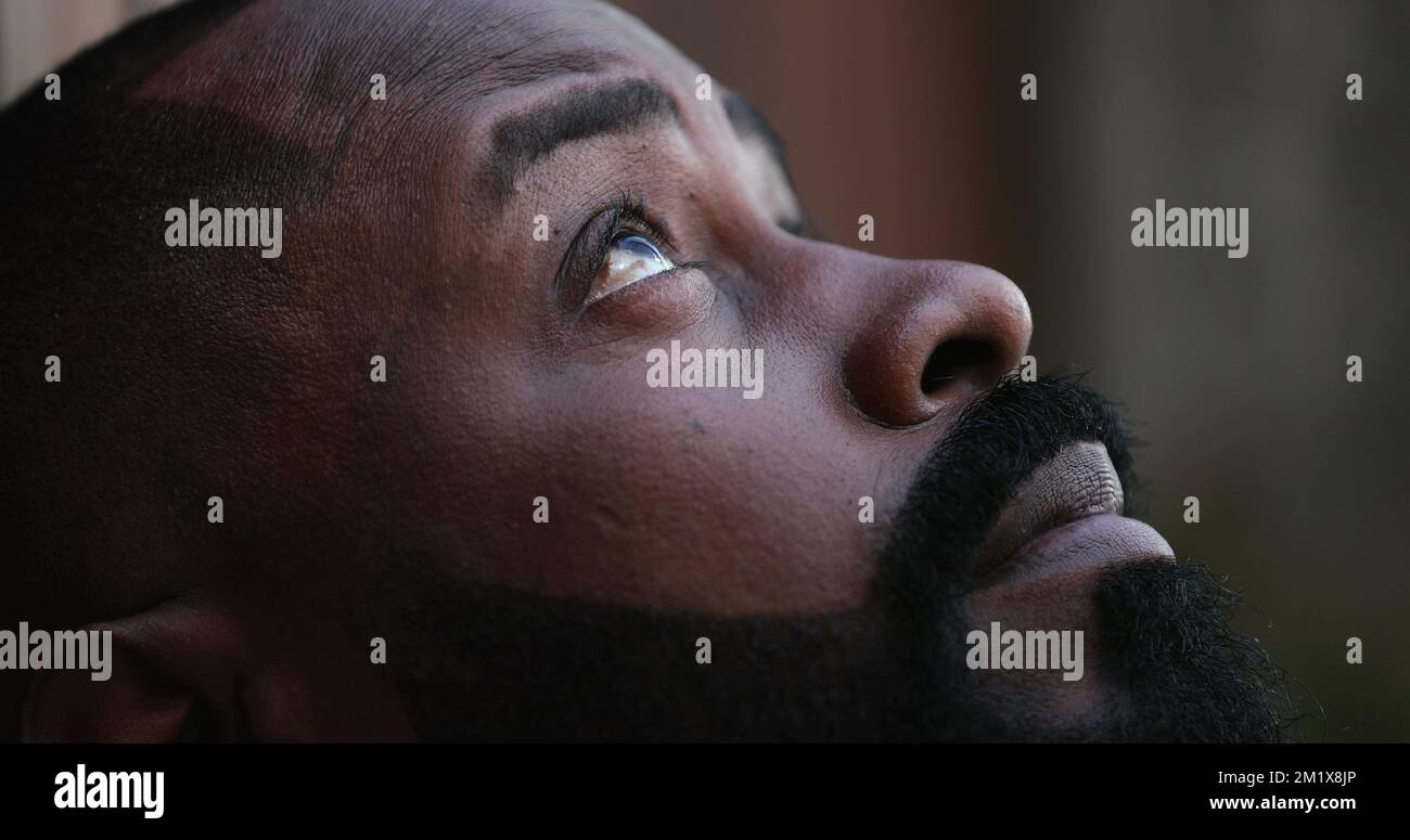 Faith african man looking sky hi-res stock photography and images - Alamy