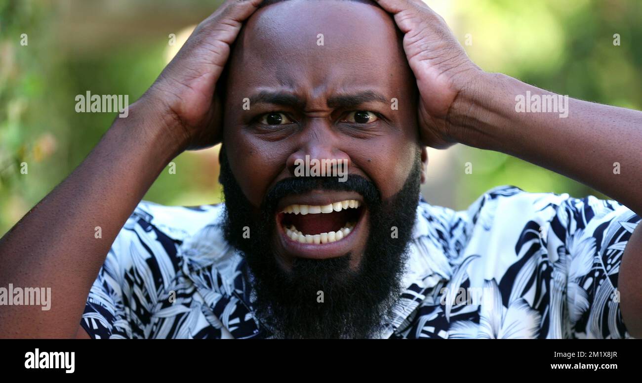 African man reacting with SHOCK and TERROR. Surprised emotion, unbelief ...