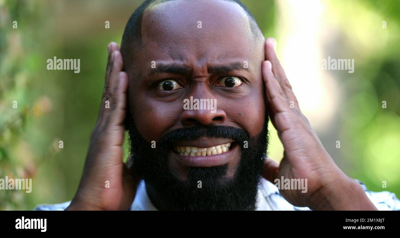 African man reacting with SHOCK and TERROR. Surprised emotion, unbelief ...
