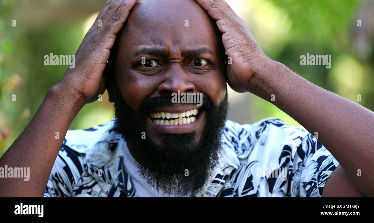 African man reacting with SHOCK and TERROR. Surprised emotion, unbelief ...