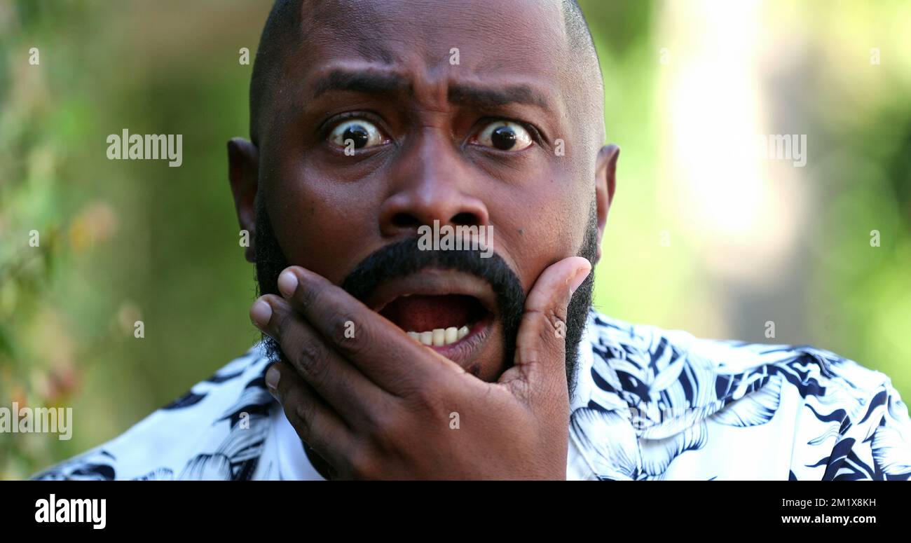 African man reacting with SHOCK and TERROR. Surprised emotion, unbelief Stock Photo - Alamy