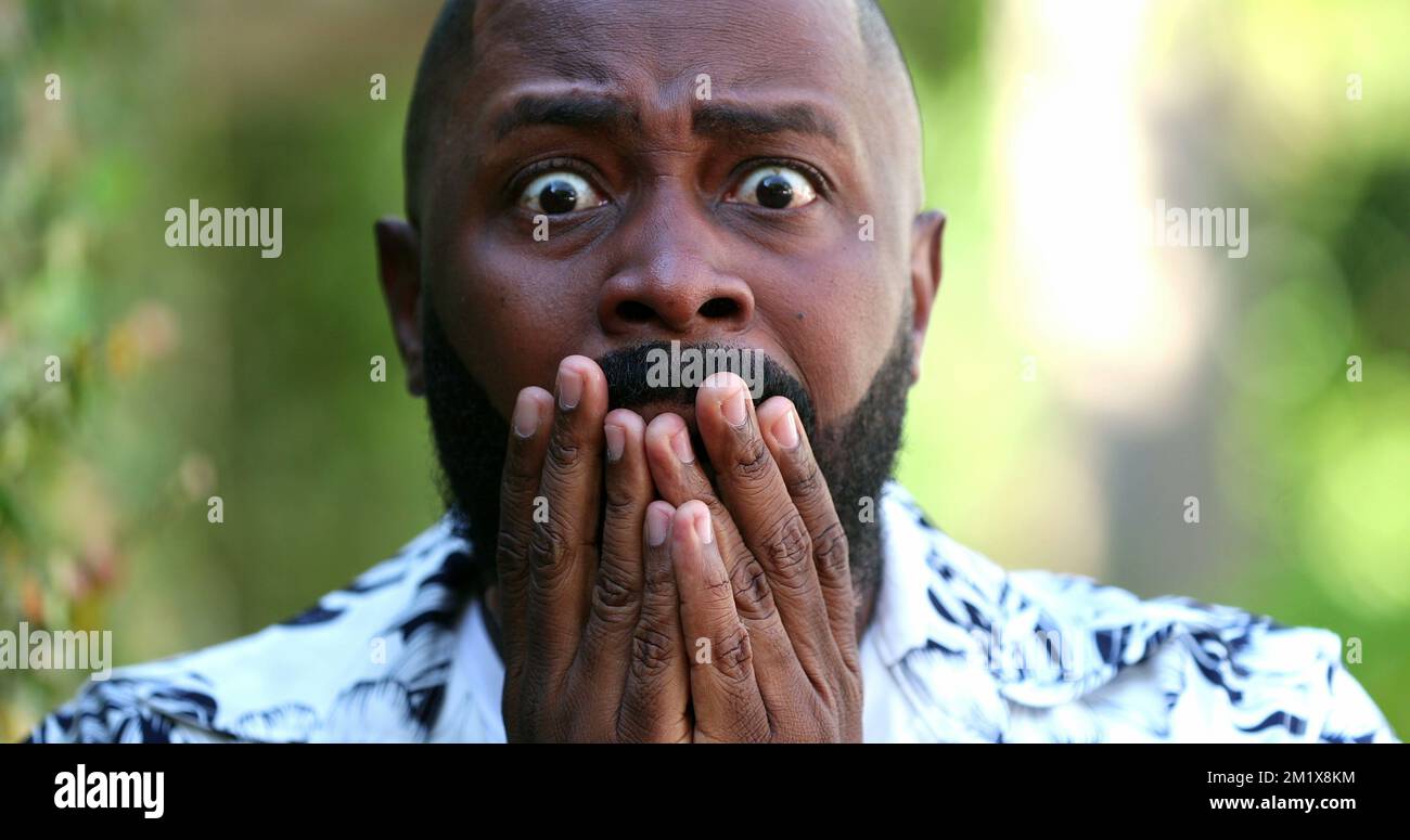 African man reacting with SHOCK and TERROR. Surprised emotion, unbelief ...