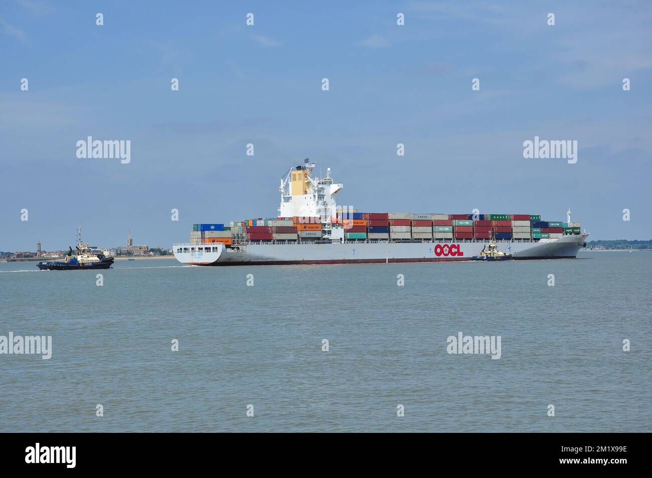 Container ship OOCL KOBE with tugs approaching Felixstowe, Suffolk ...