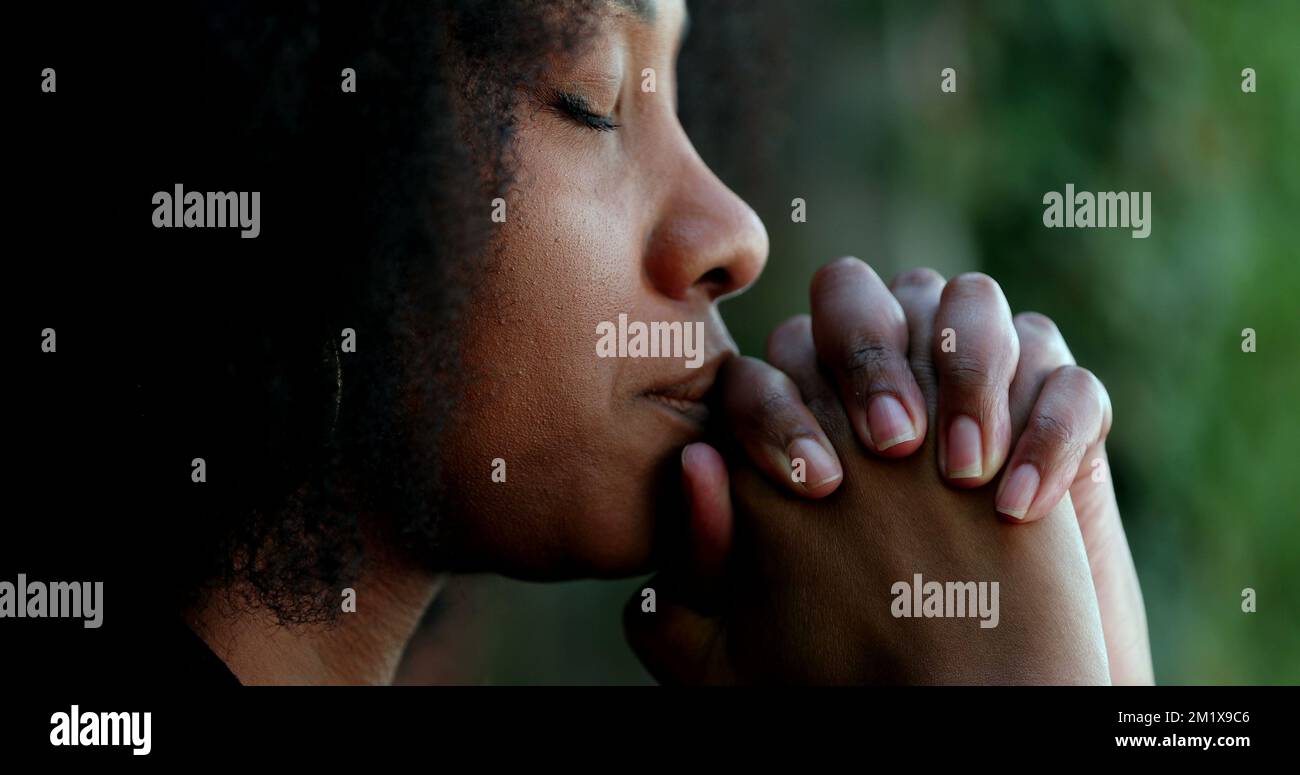African woman praying to God Stock Photo - Alamy