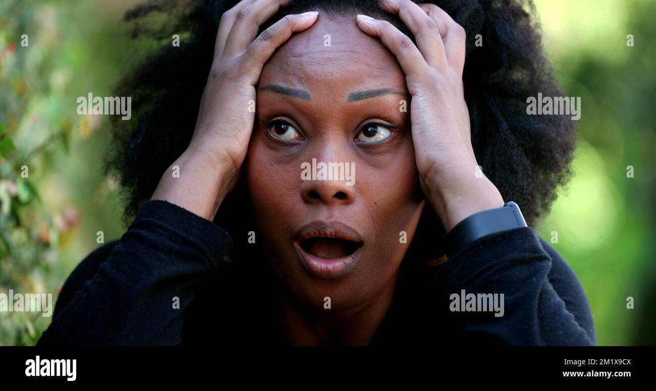 African woman reacting with SHOCK and SURPRISE Stock Photo - Alamy