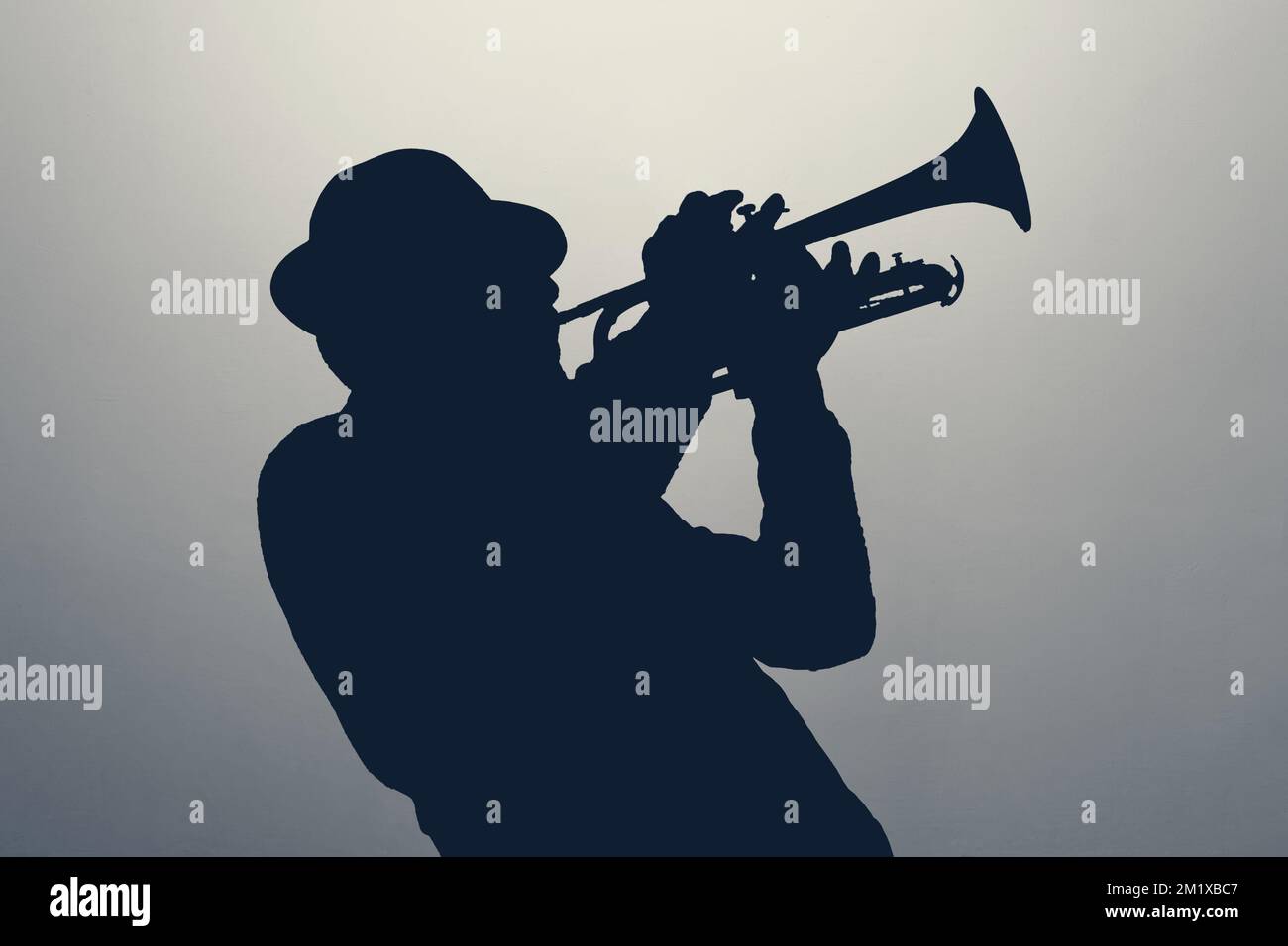 silhouette of a jazz man playing trumpet Stock Photo - Alamy