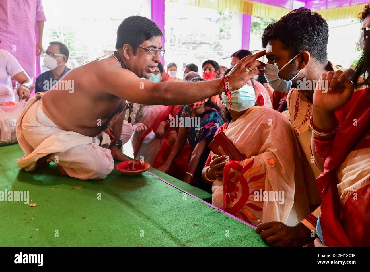 Howrah, West Bengal, India - 14th October 2021 : Hindu Purohit putting ...