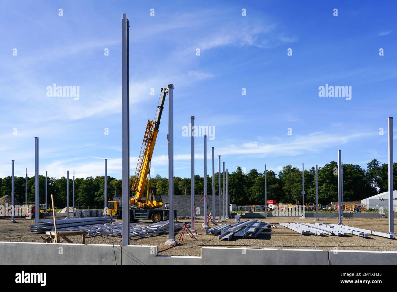 Construction site of a new modern industrial building with vertical ...