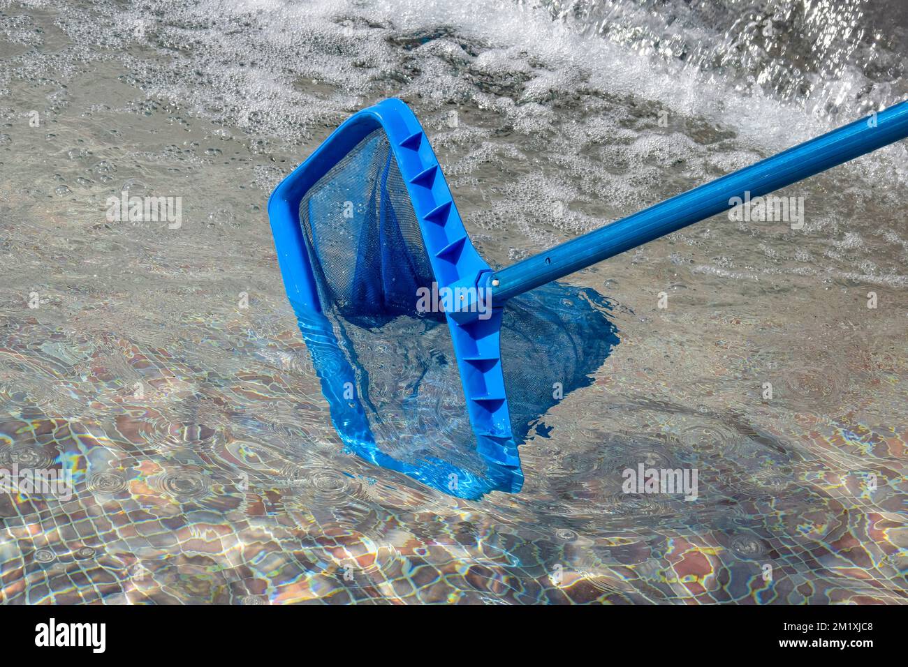 Mesh net for cleaning pool from debris. Cleaning pool, city fountain ...