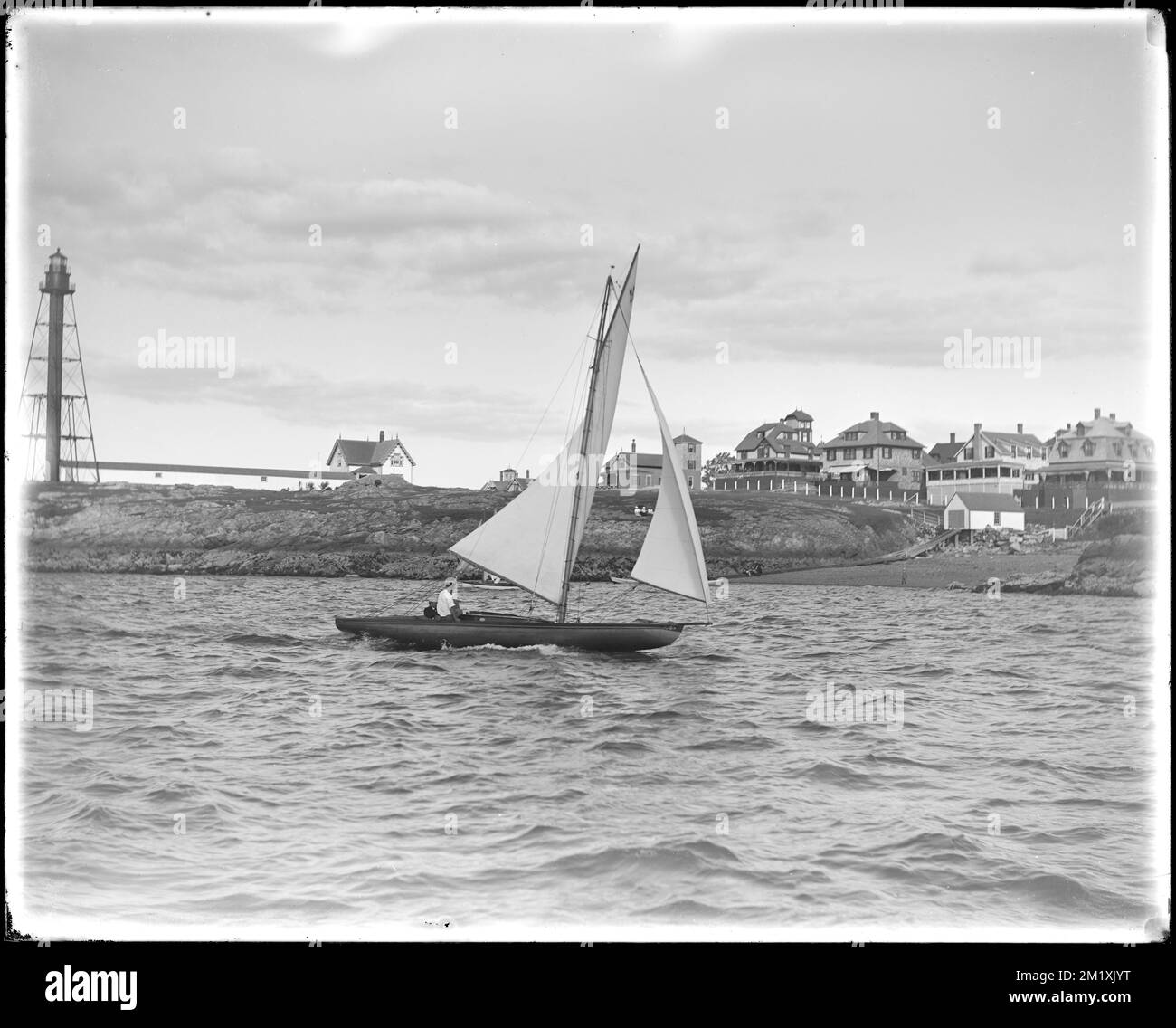Boat sailing into Marblehead Harbor past Marblehead light tower ...