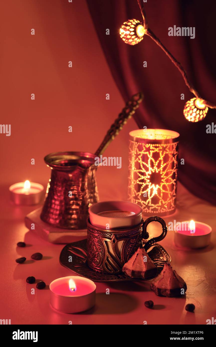 Turkish coffee pot and traditional cup with oriental sweets. Metal ...