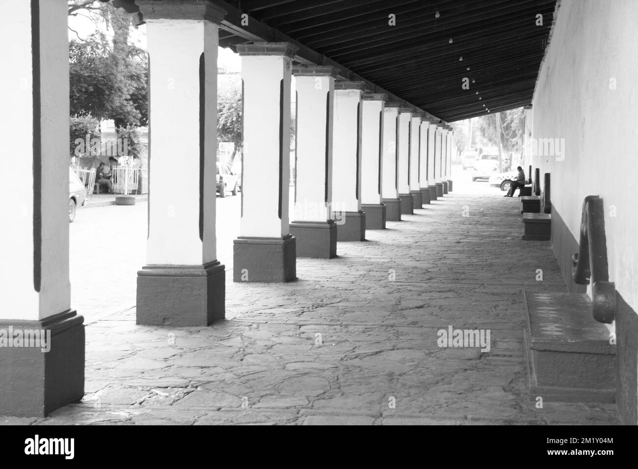 A grayscale of an old town corridor in Mexico Stock Photo - Alamy