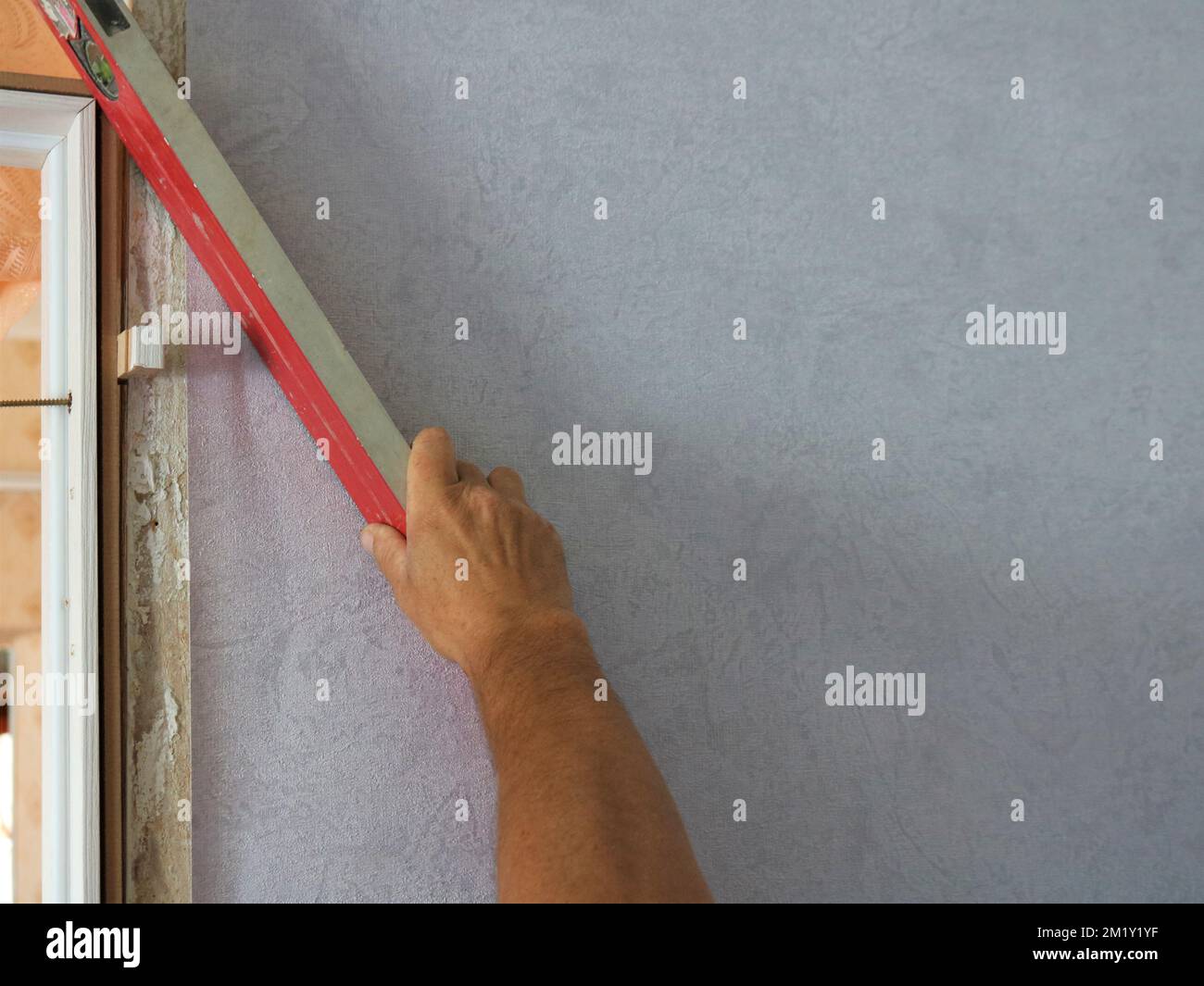 working with a level to check the desired angle during repairs in the ...