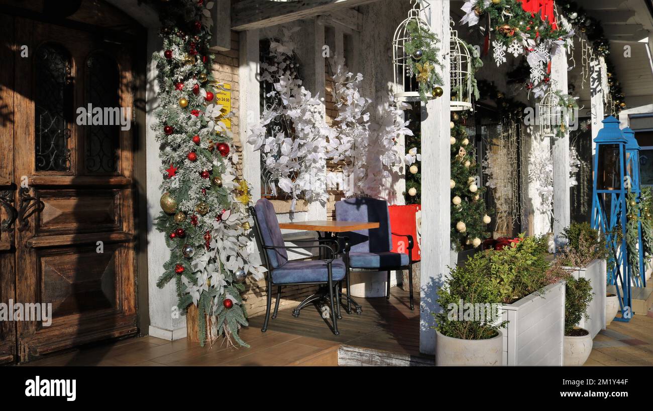 Christmas decorated restaurant with outdoor tables on a secluded ...