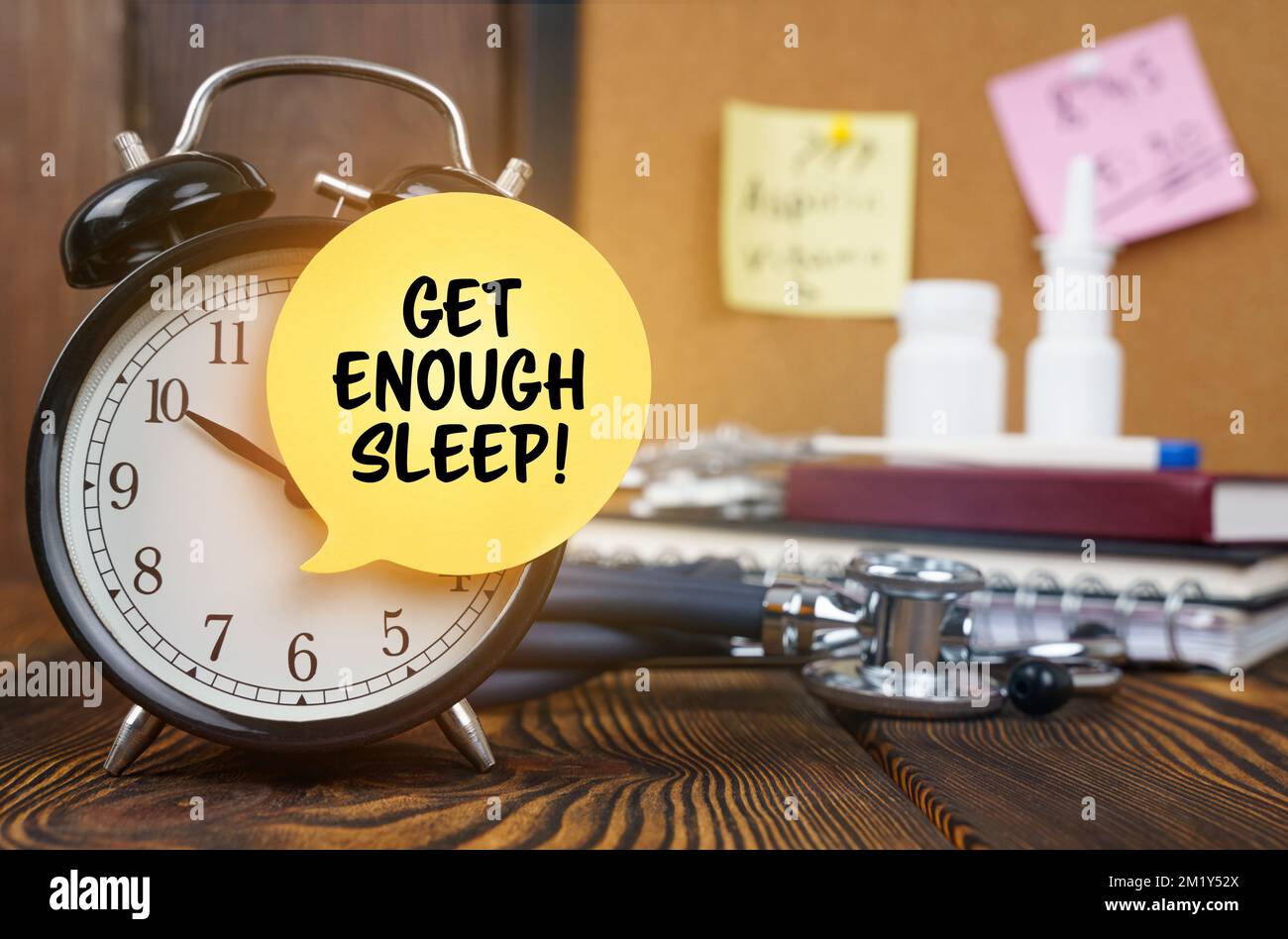 Medical concept. On the alarm clock a sticker with the inscription ...