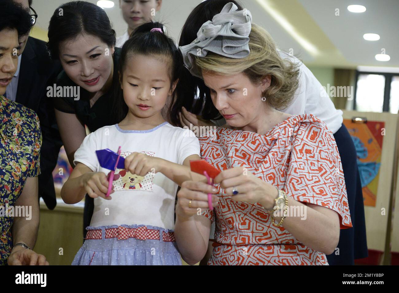 20150622 - WUHAN, CHINA: Queen Mathilde of Belgium makes like a girl ...