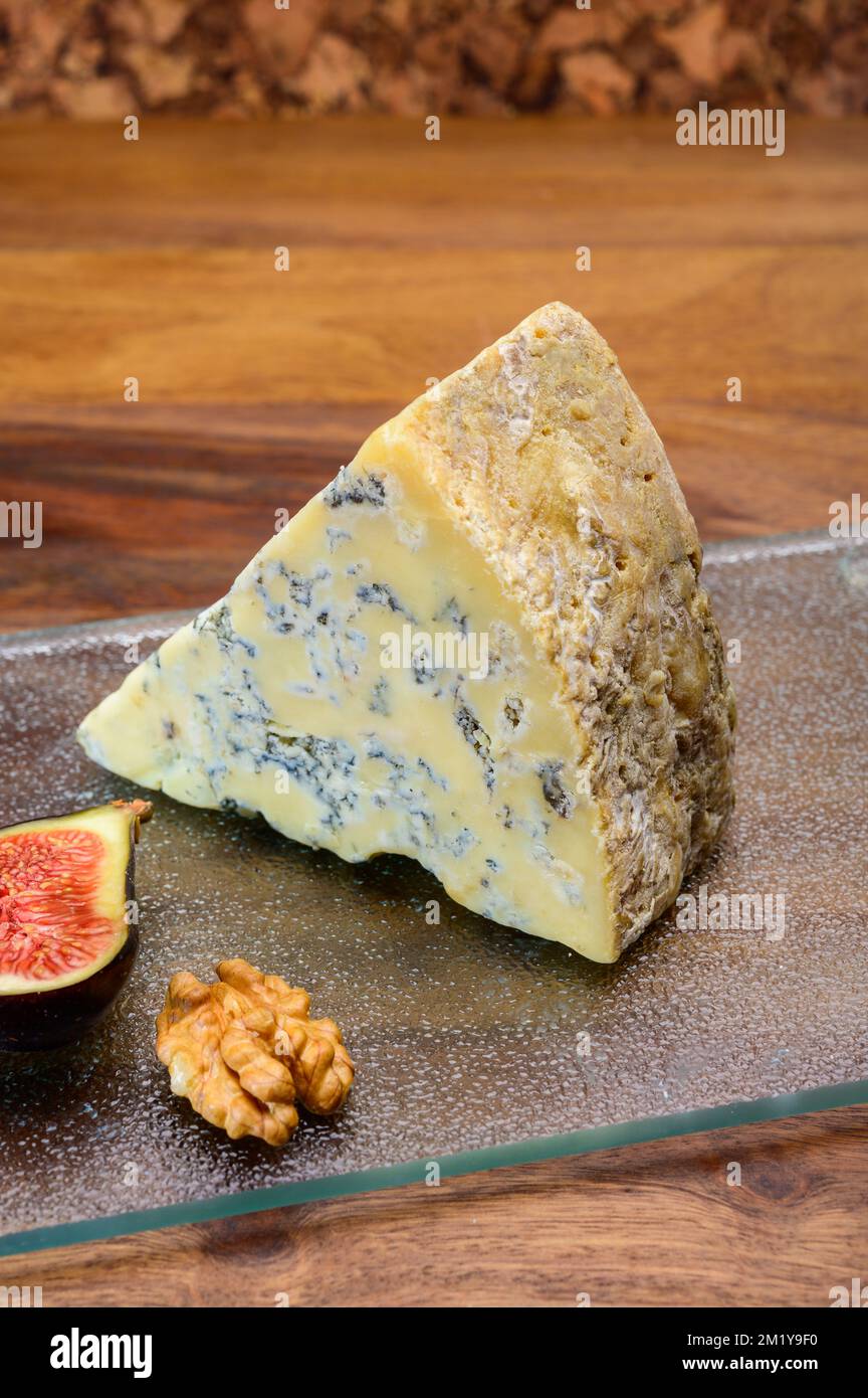 Cheese collection, piece of English old stilton blue cheese close up ...