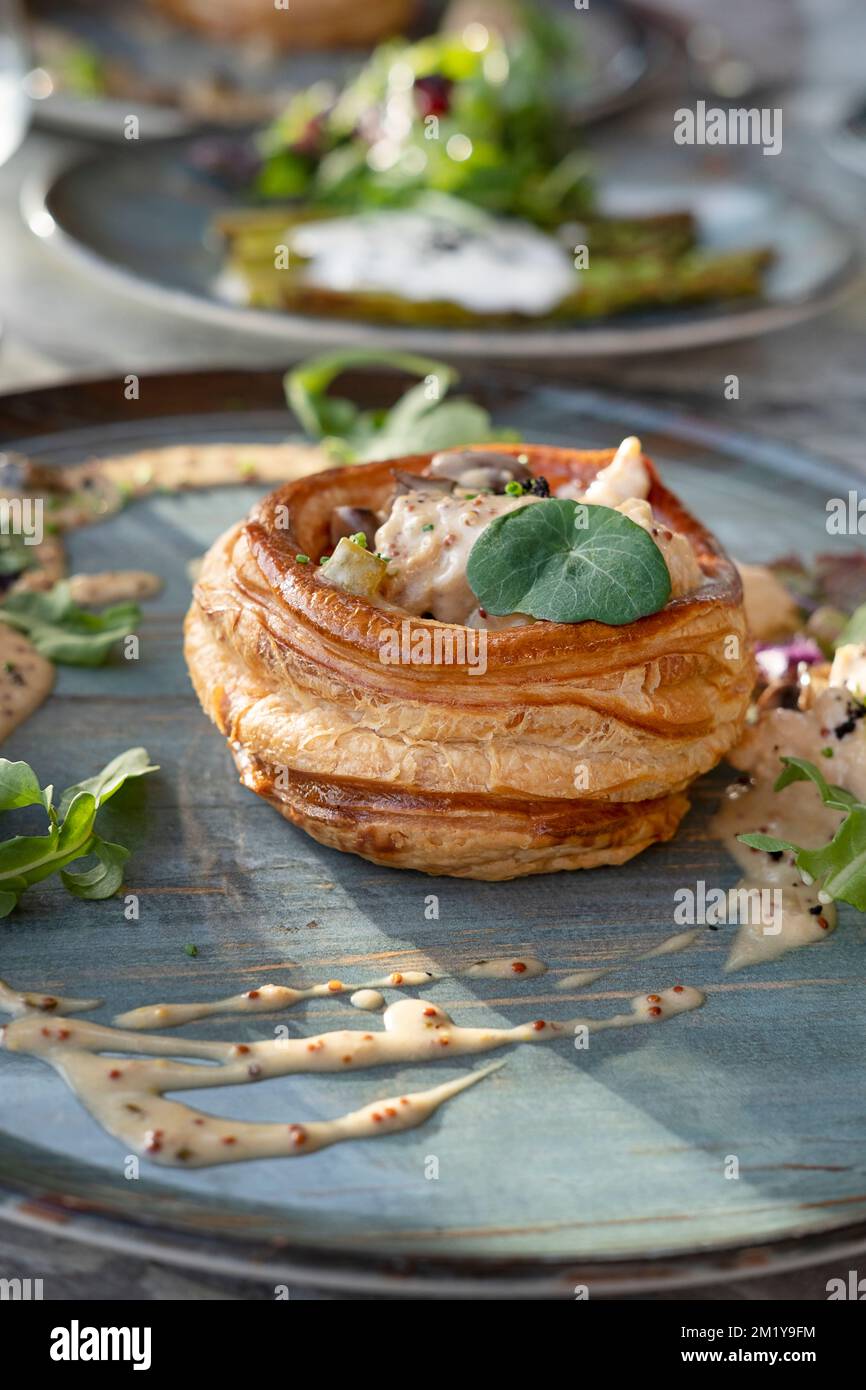 Chicken and mushroom vol-au-vent on a styled ceramic plate, delicious ...