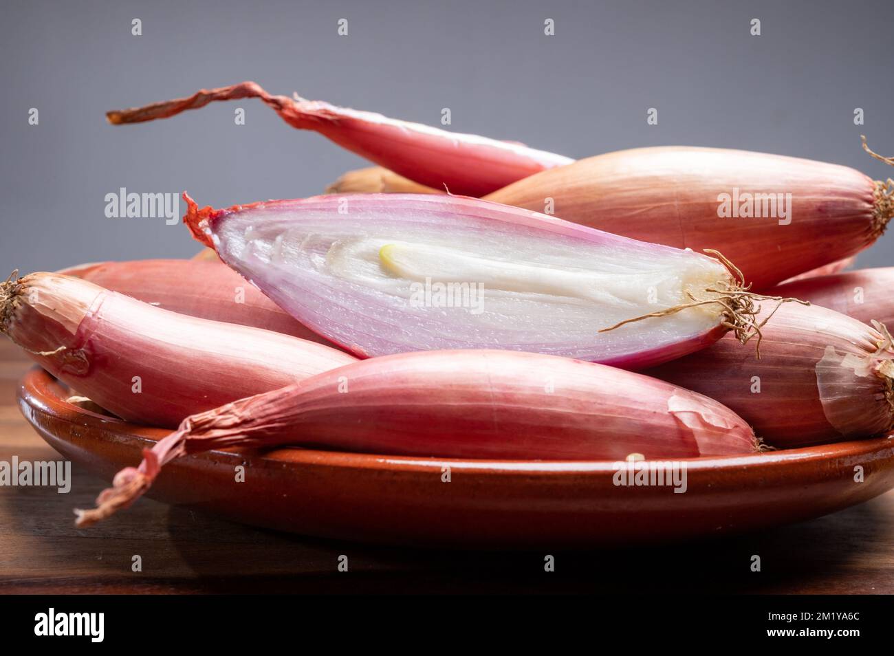 Onion collection, pink long French shallot onlons close up Stock Photo ...
