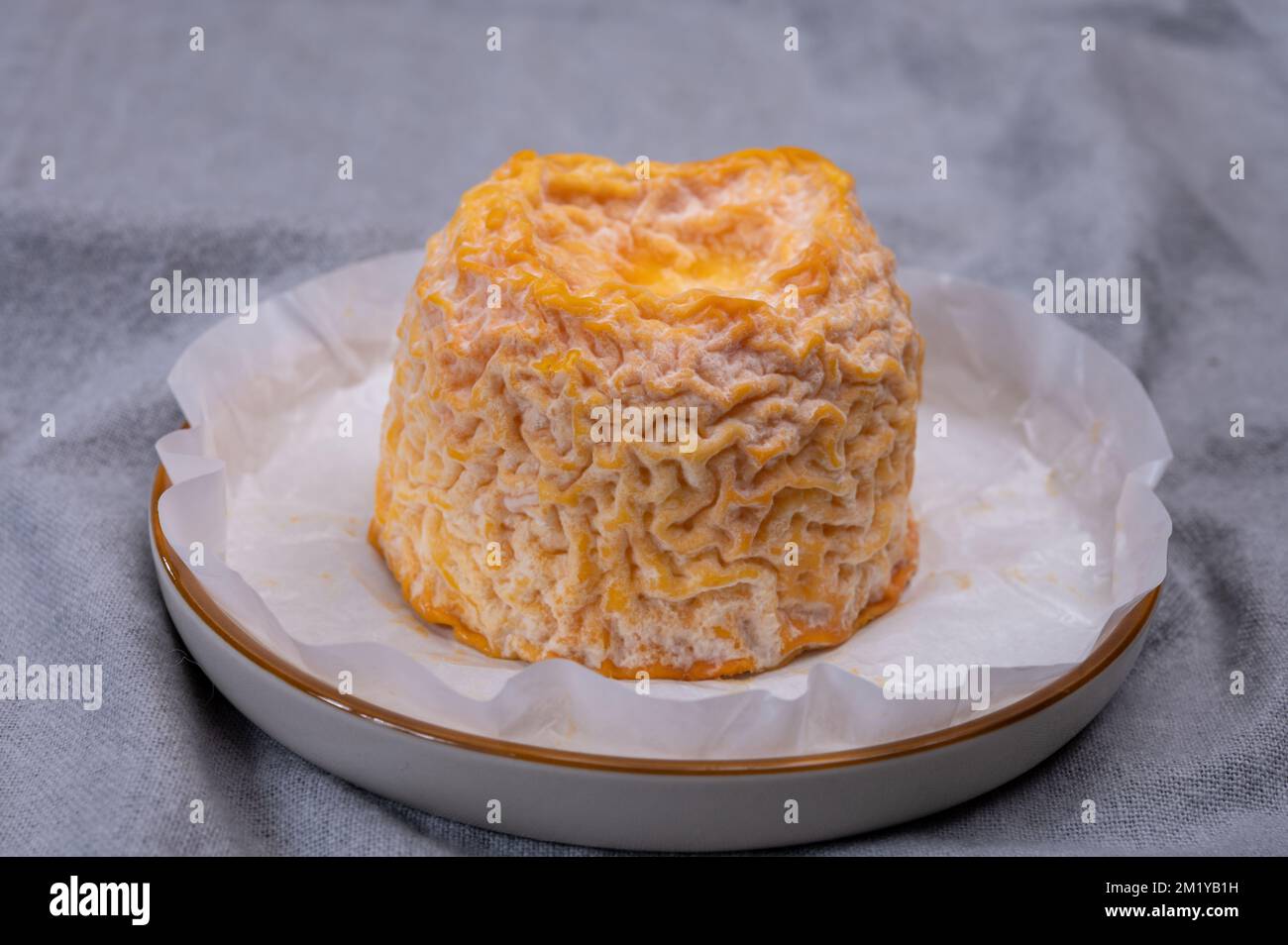 French Langres soft cows crumbly cheese with washed rind structure made ...