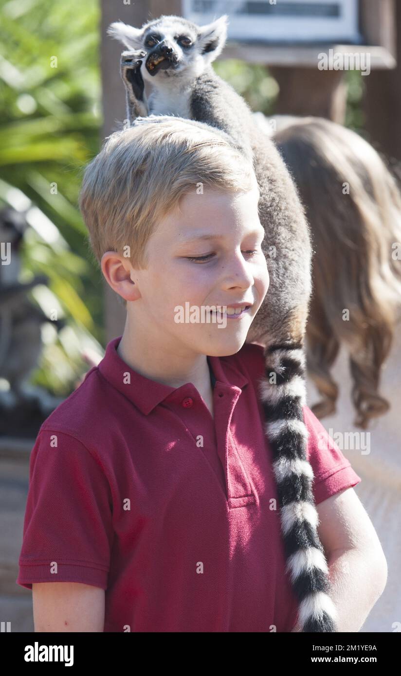 Prince Emmanuel pictured with a lemur on his shoulder during a ...