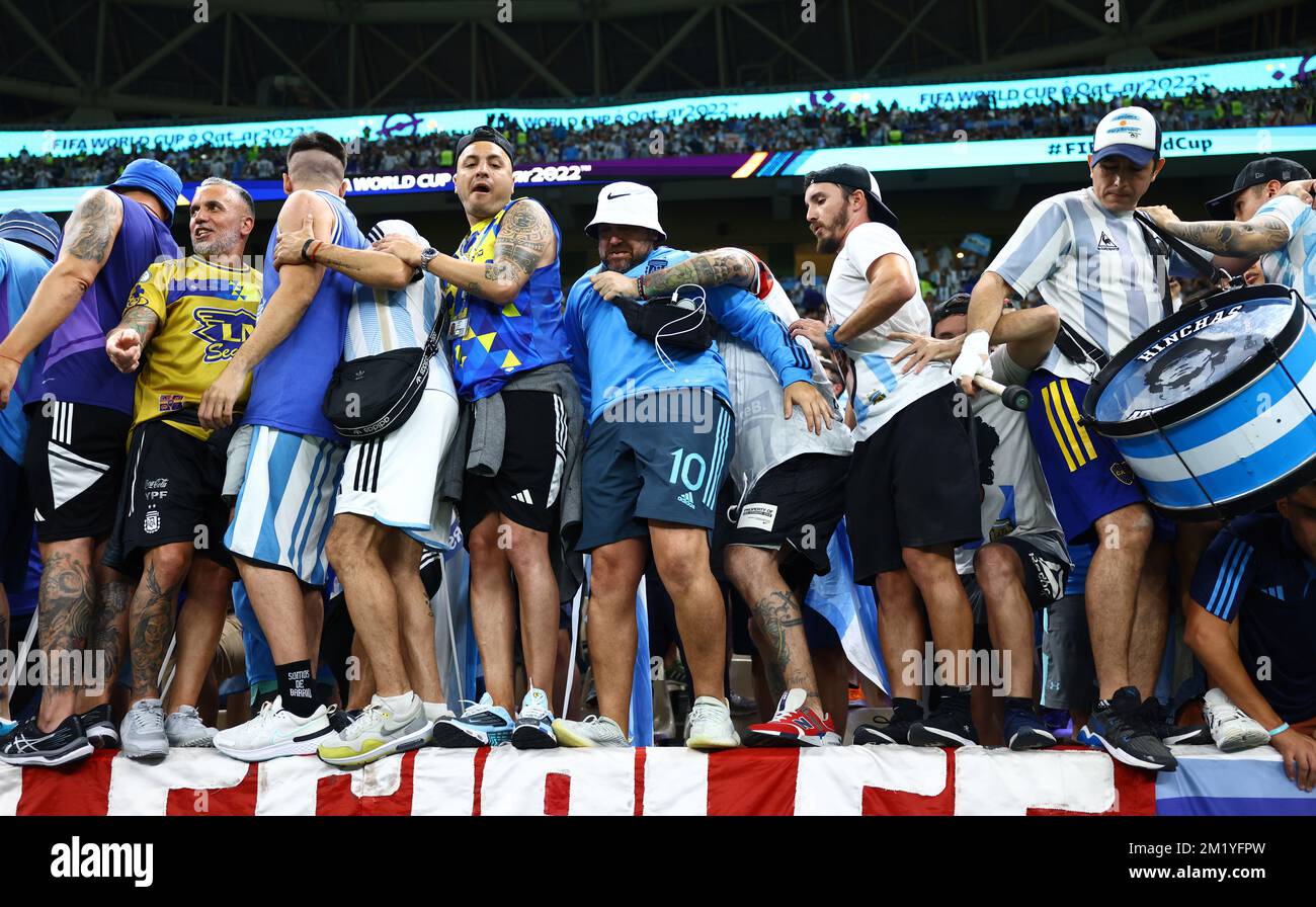 Doha, Qatar, 13th December 2022. Argentina fans stumble during the FIFA ...
