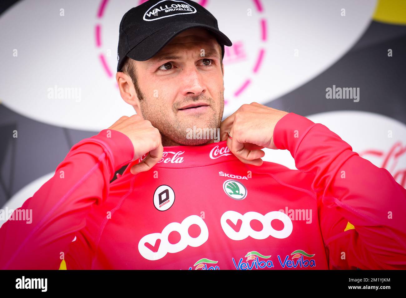 Belgian Sebastien Delfosse celebrates on the podium after the fourth ...