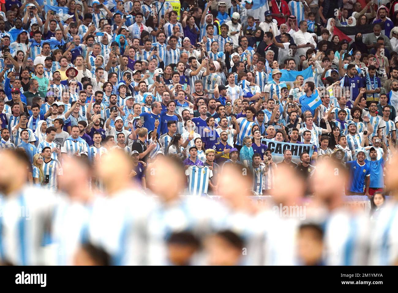 Argentina fans sing with the players during the national anthem before ...