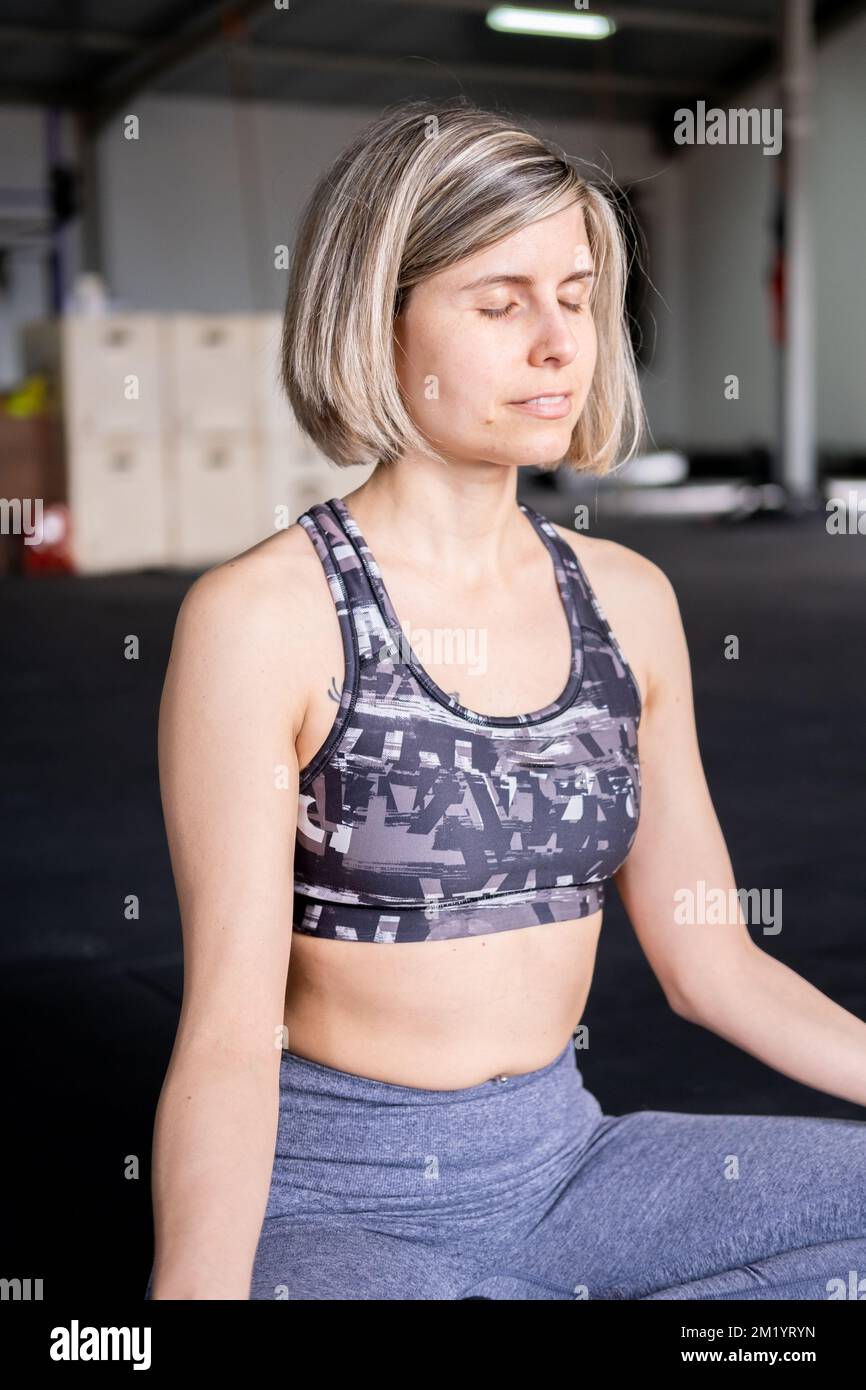 Close-up photo of a smiley and relaxed mid adult woman resting and ...