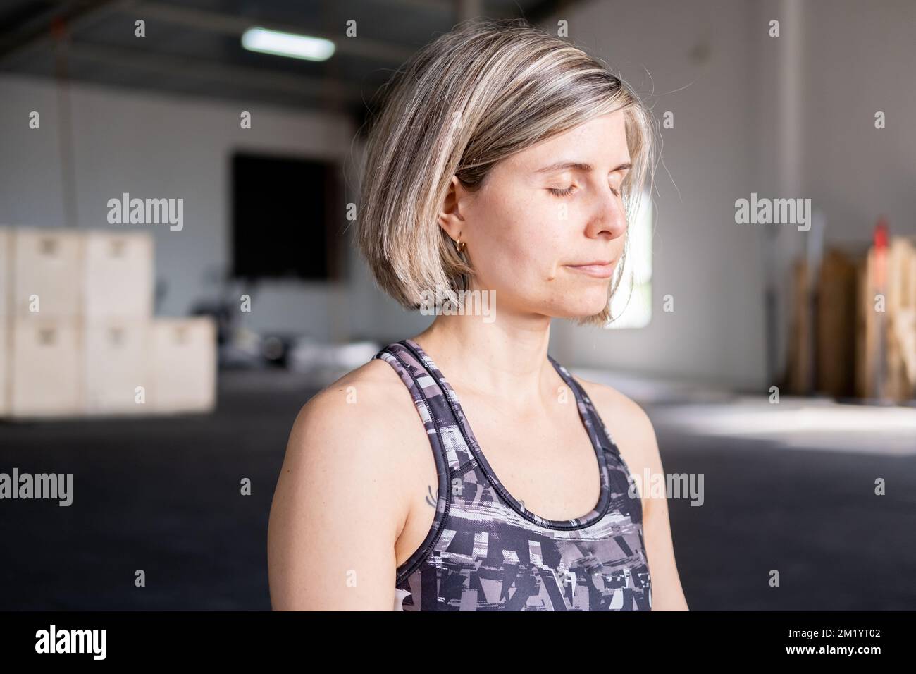 Close-up photo of a smiley and relaxed mid adult woman resting and ...