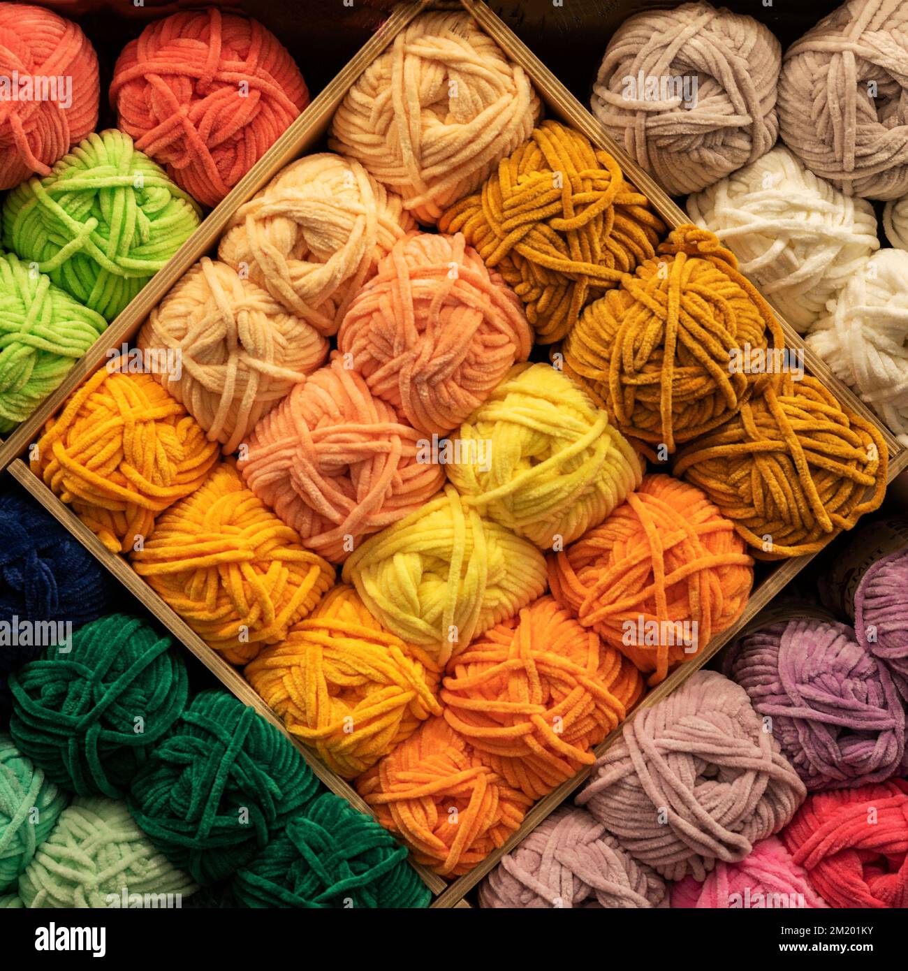Shop shelf with bright multicolored yarn for knitting. Sale of goods ...