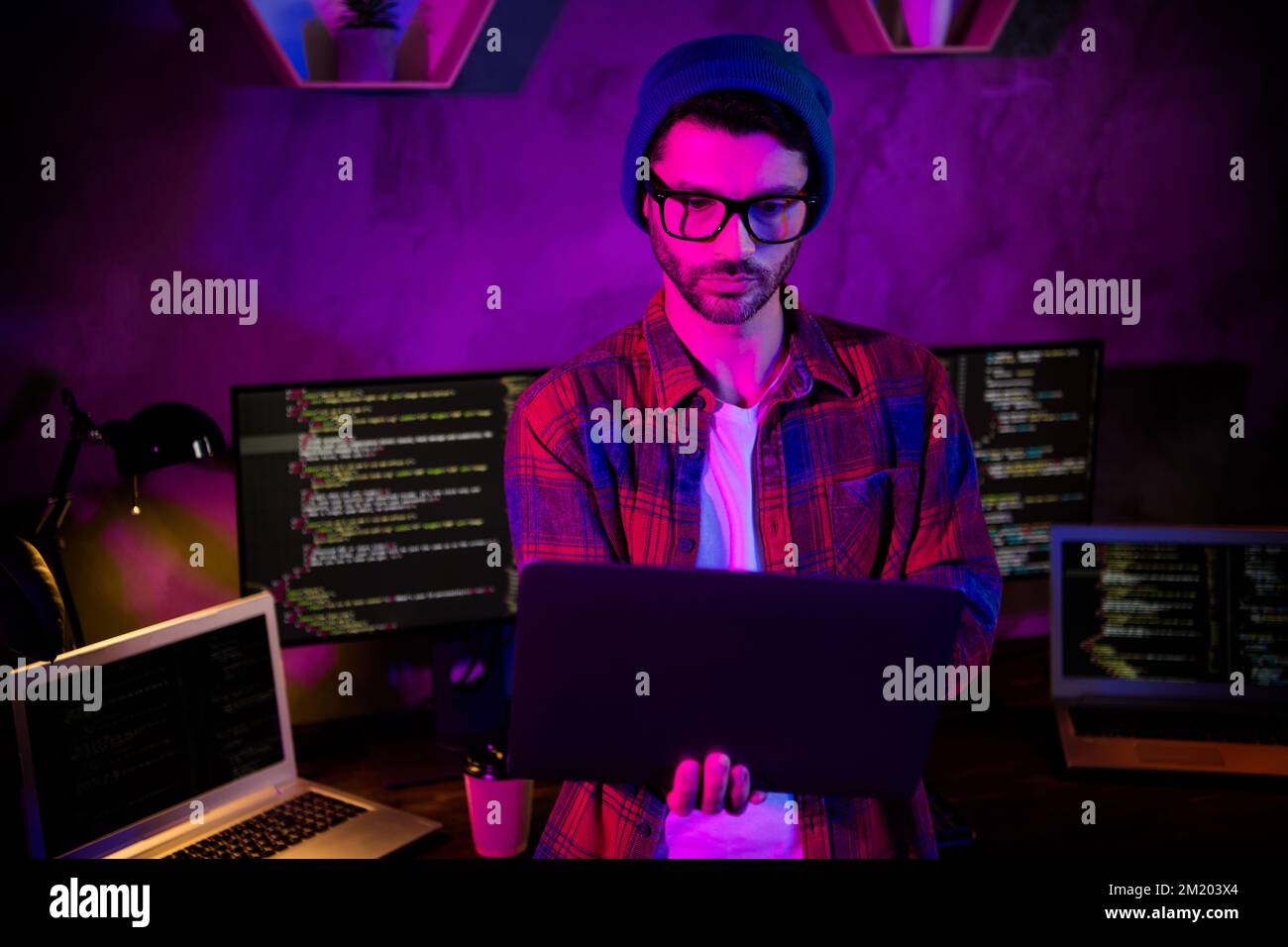 Photo of serious confident coder dressed hat eyewear framework modern ...