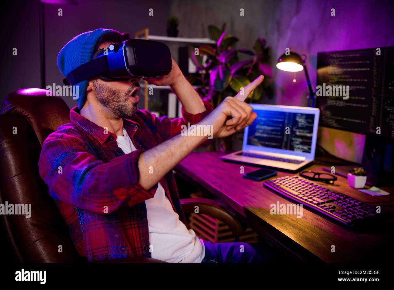 Photo of impressed funky freelancer wear hat eyeglasses modern gadget ...