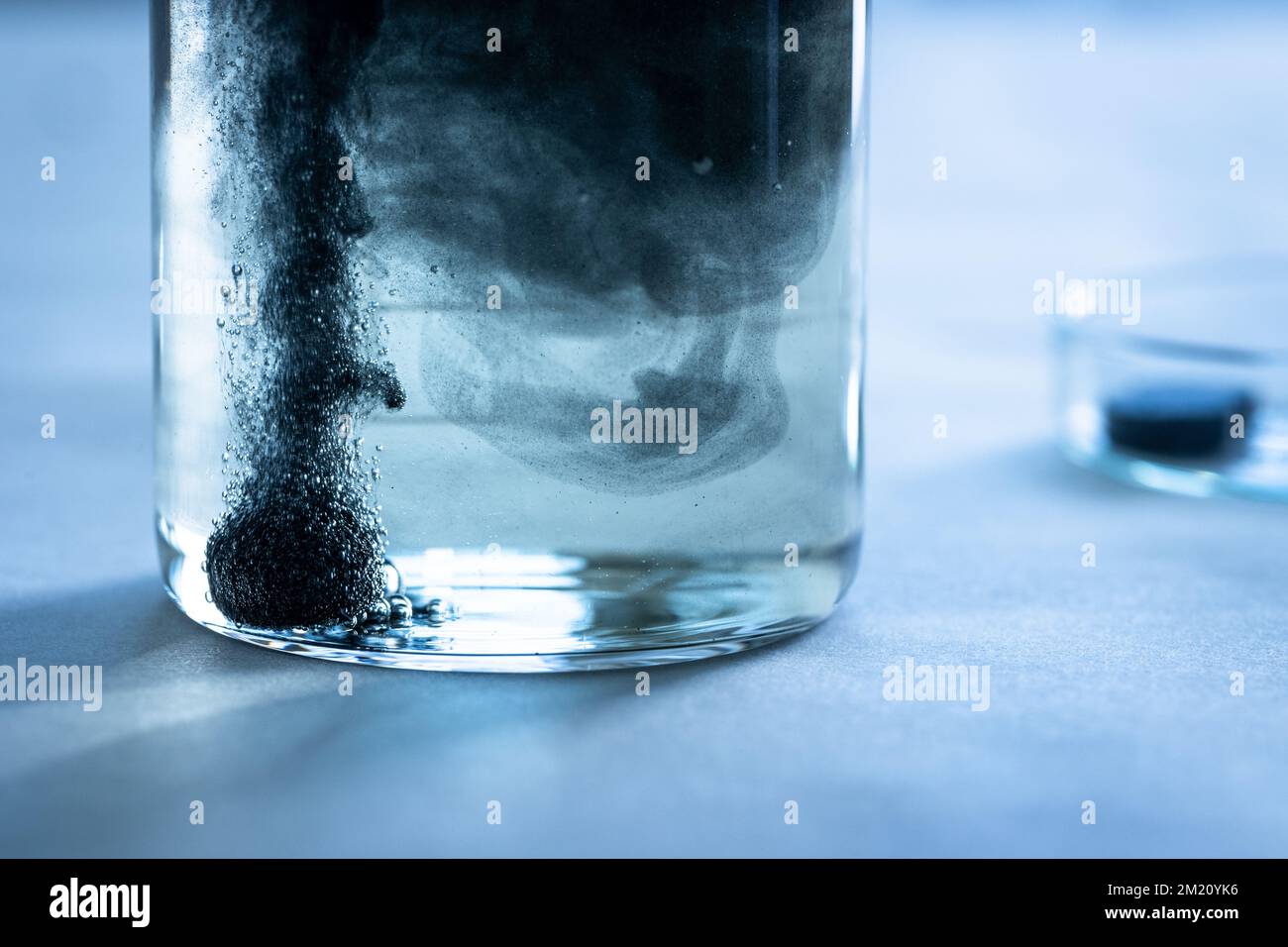 Iron nanoparticles in a lab, on a white glossy surface Stock Photo - Alamy