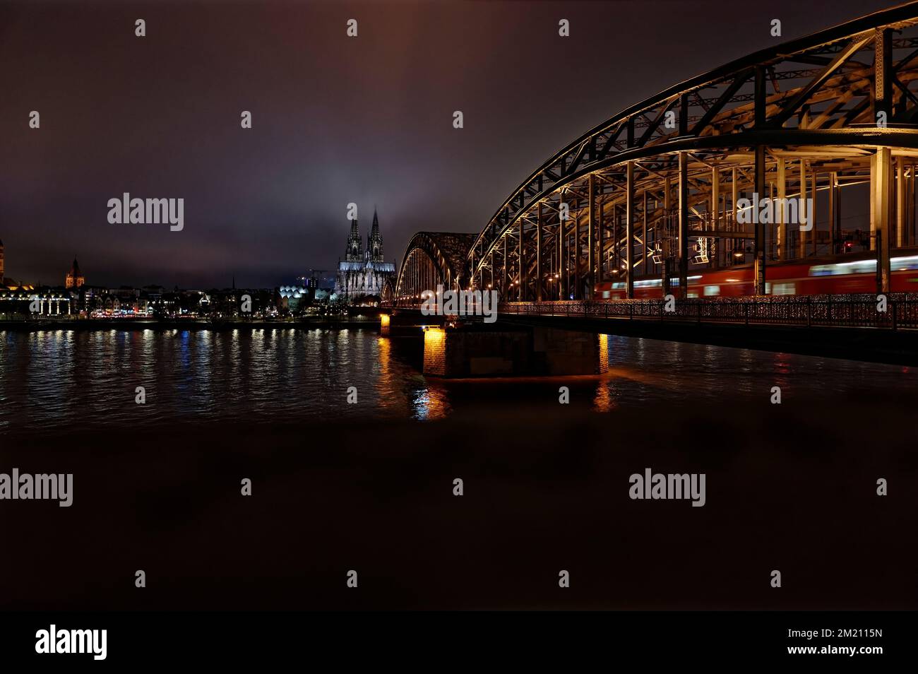 A landscape view of the modern bridge over the river with a cityscape ...
