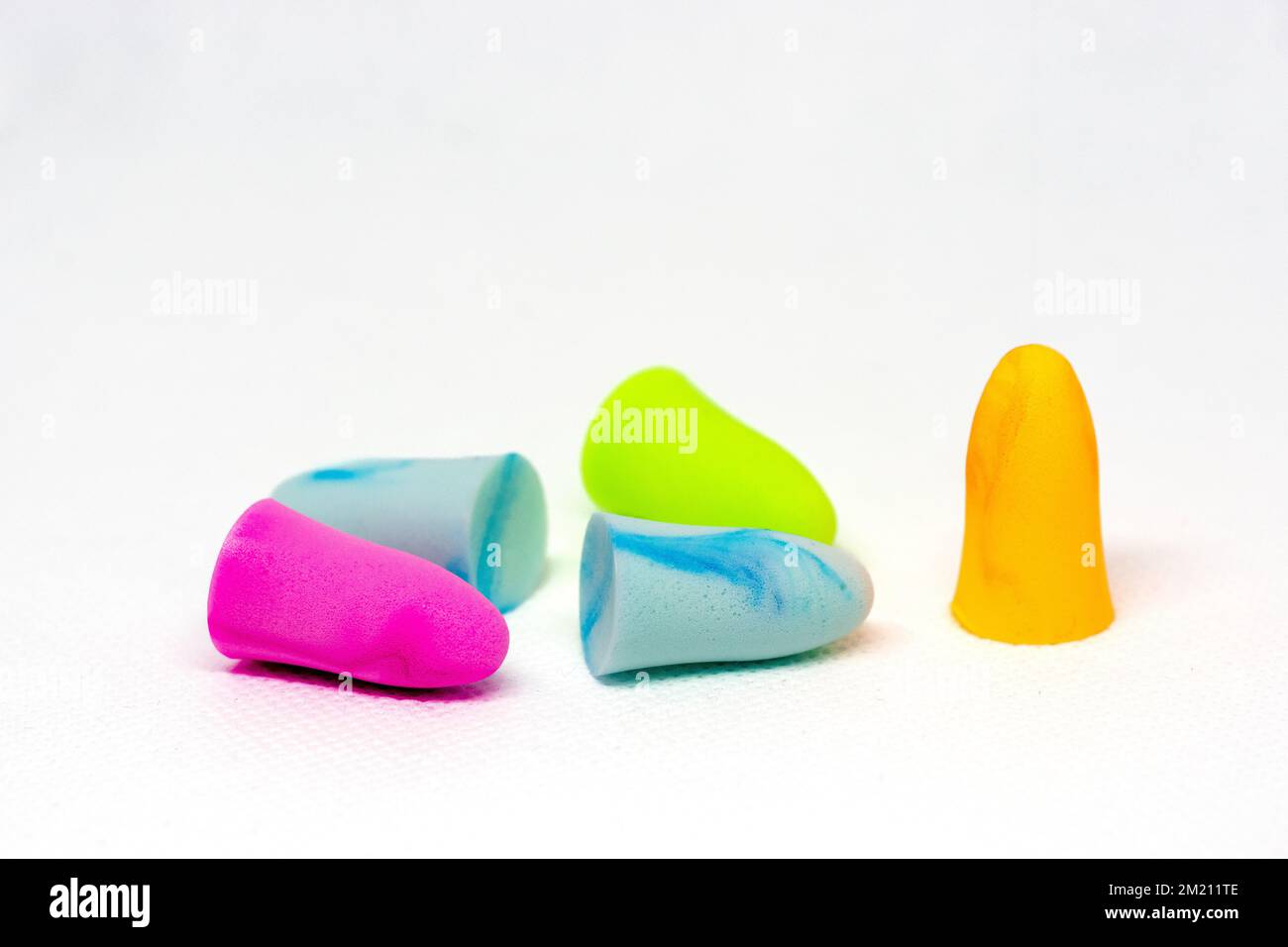 Set of colorful earplugs isolated on white background with space for ...