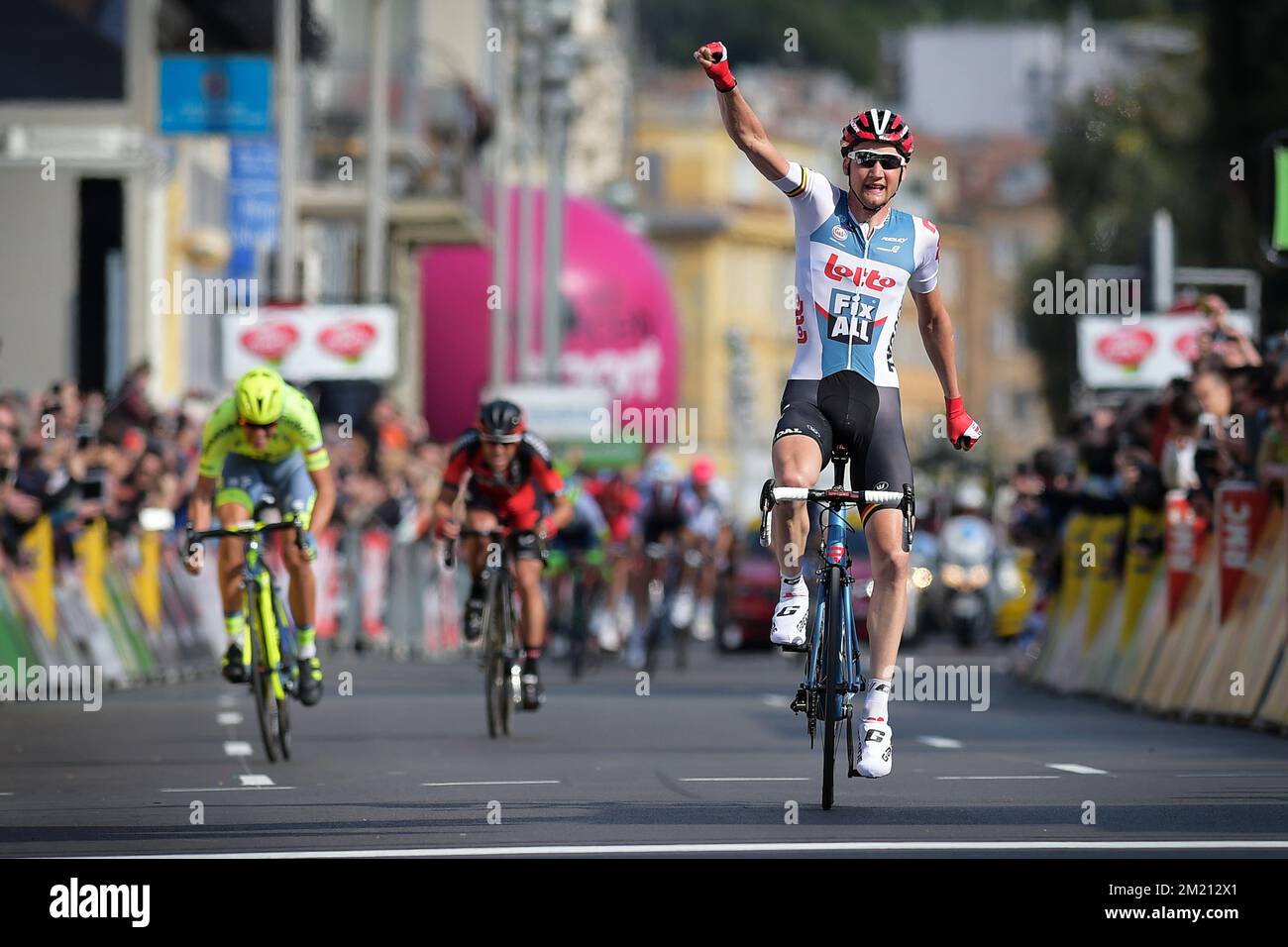 Belgian Tim Wellens of Lotto Soudal celebrates as he crosses the finish ...
