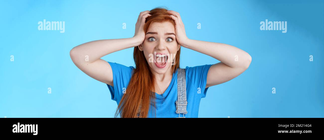 Shocked redhead girl shouting panic, feel pressured deadlines, scared ...