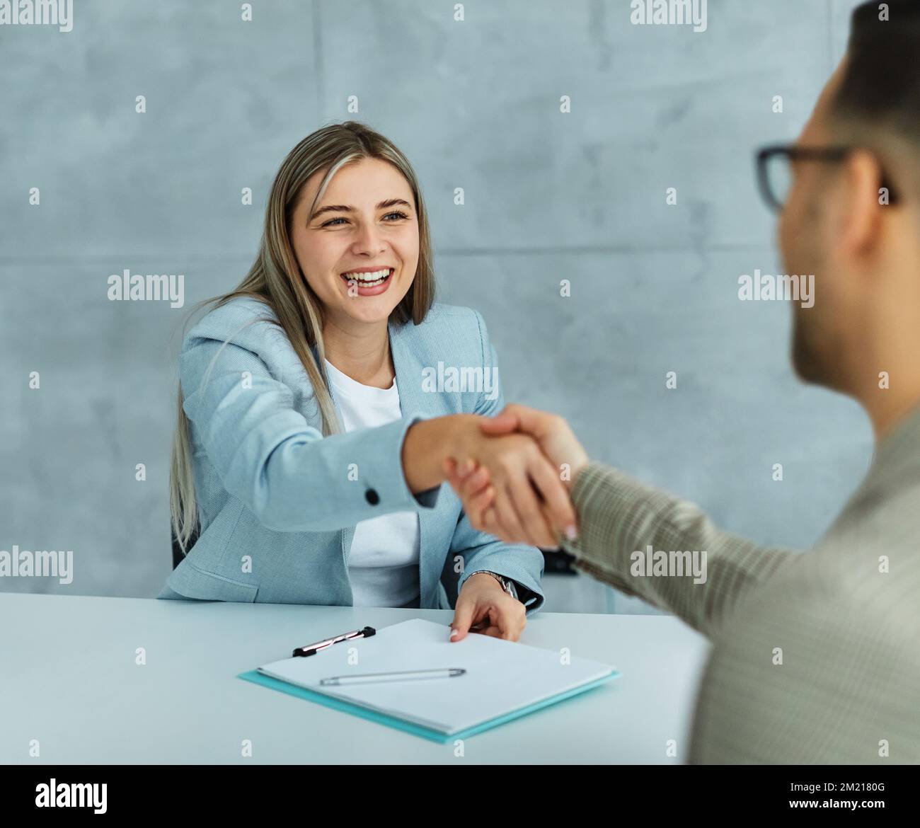 young business businesswoman handshake hand shake shaking meeting agreement office teamwork ...