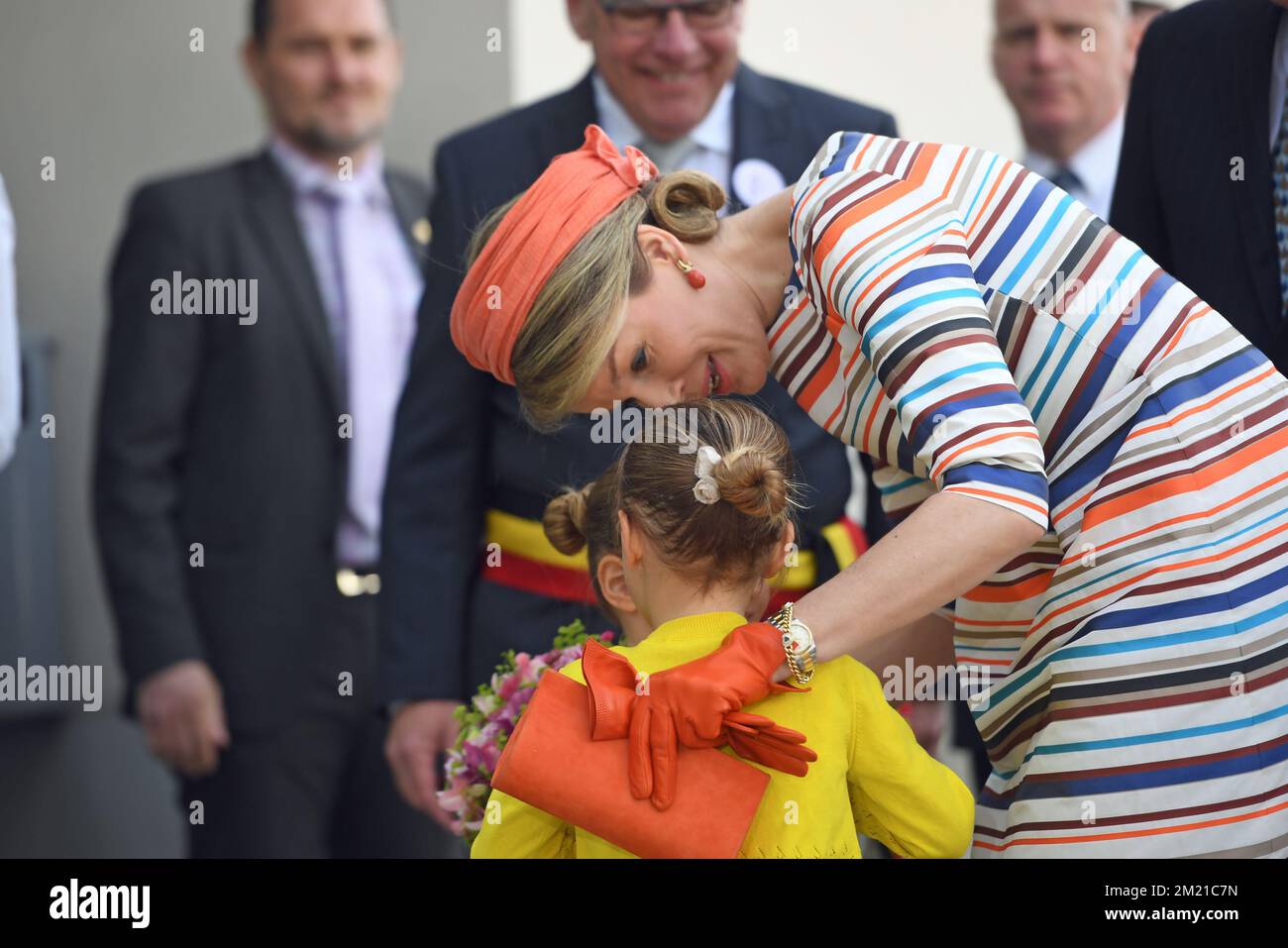 Queen Mathilde of Belgium is welcomed by children as she arrives for a ...