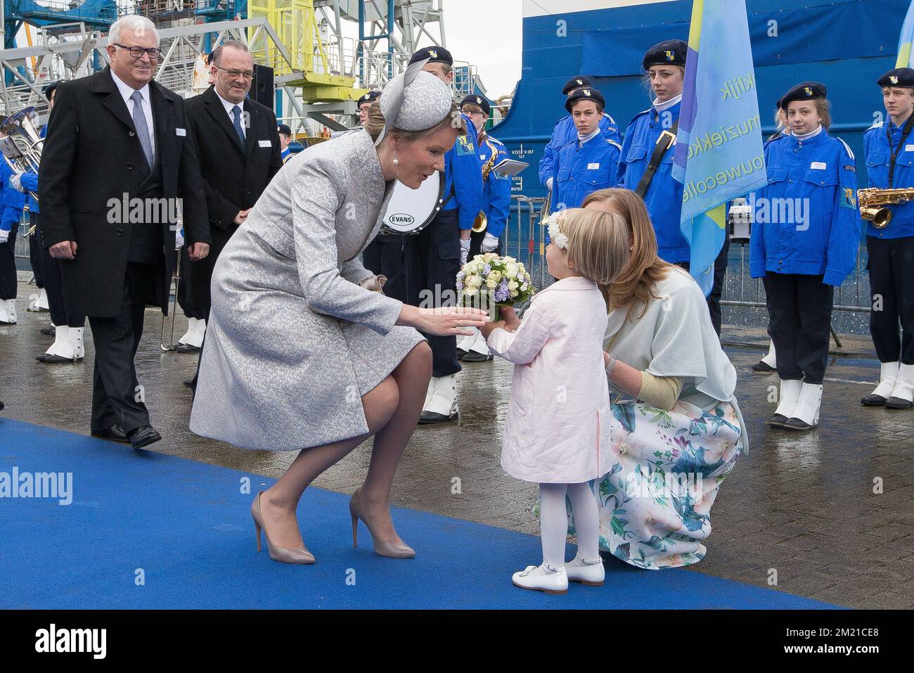 Queen Mathilde of Belgium (C) receives flowers at the ceremonial ship ...