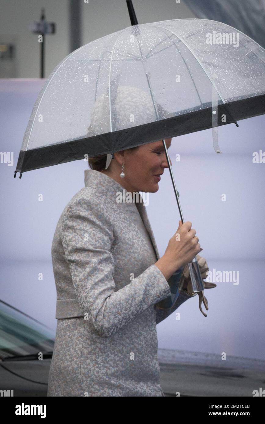 Queen Mathilde of Belgium pictured with an umbrella at the ceremonial ...