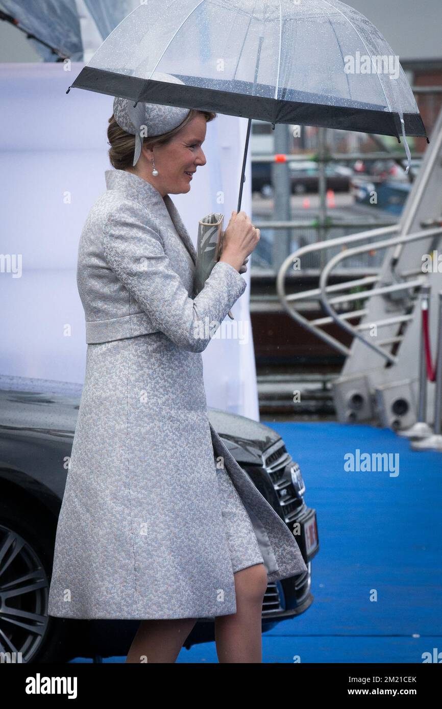 Queen Mathilde of Belgium pictured with an umbrella at the ceremonial ...