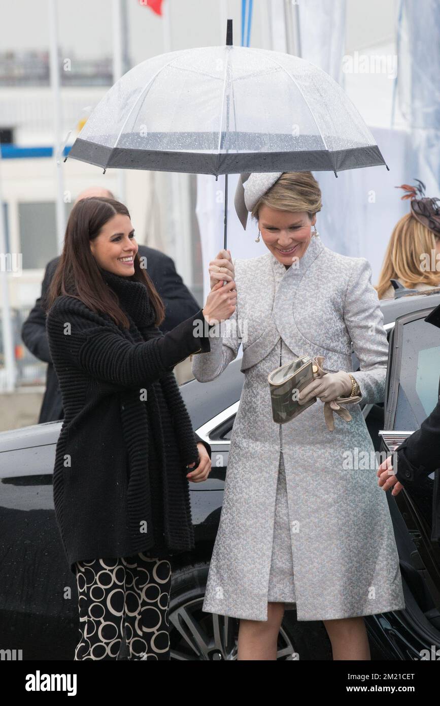 Queen Mathilde of Belgium pictured with an umbrella at the ceremonial ...