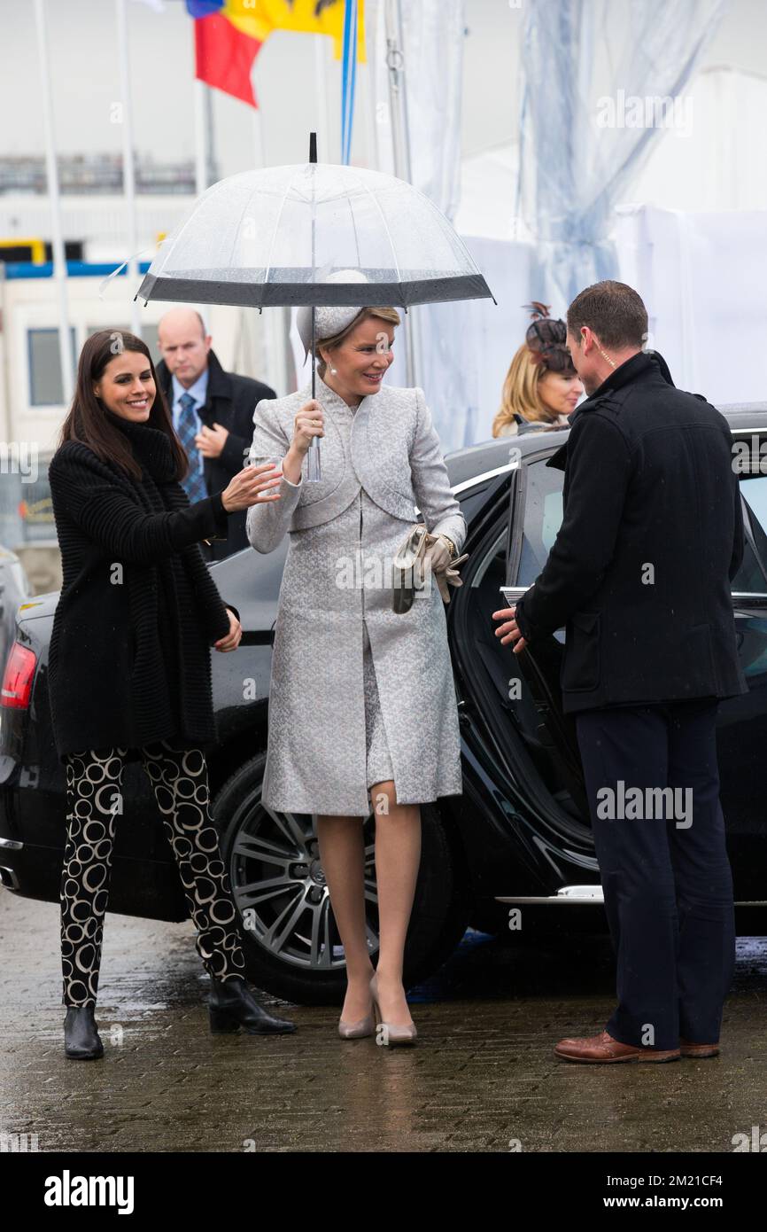 Queen Mathilde of Belgium pictured with an umbrella at the ceremonial ...