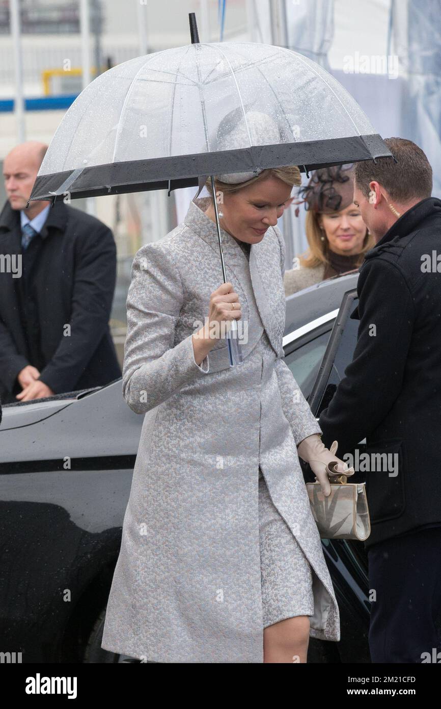 Queen Mathilde of Belgium pictured with an umbrella at the ceremonial ...