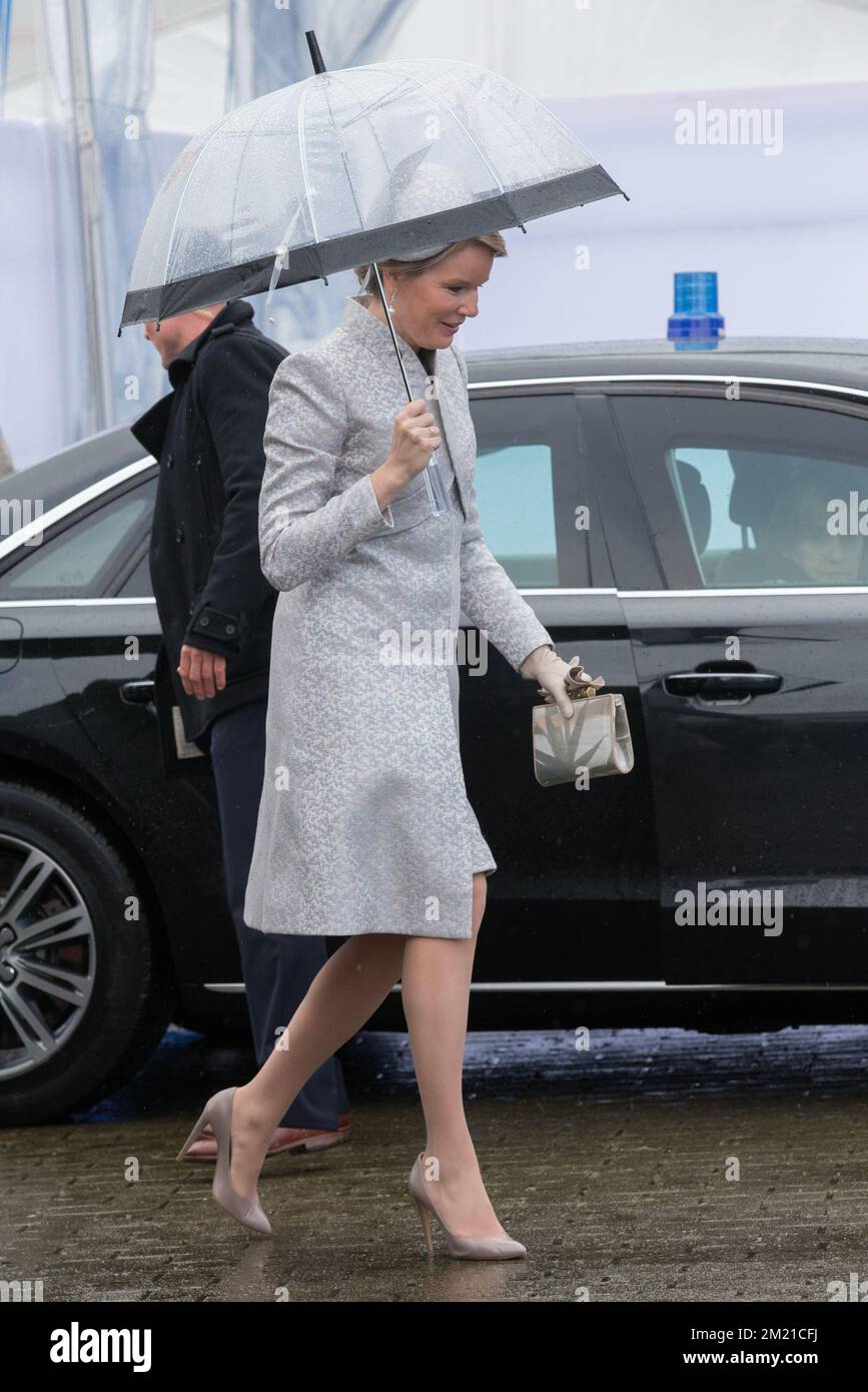 Queen Mathilde of Belgium pictured with an umbrella at the ceremonial ...
