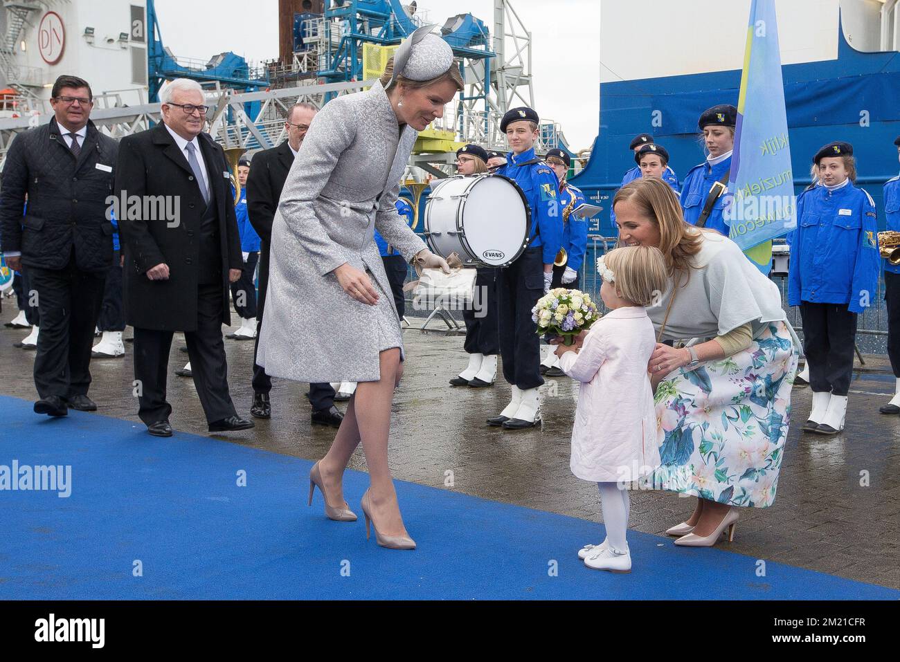 Queen Mathilde of Belgium (C) receives flowers at the ceremonial ship ...